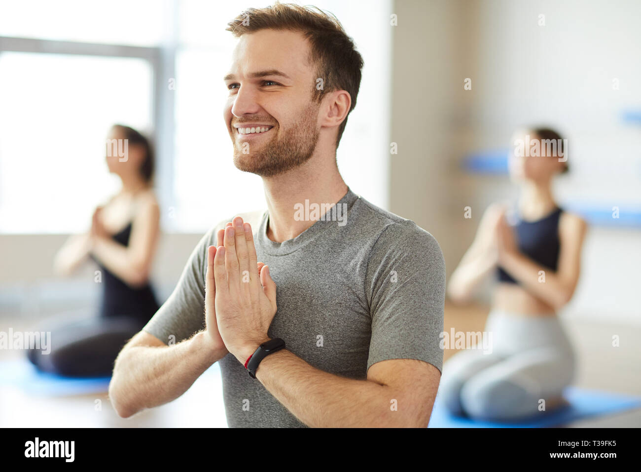 Happy man enjoying meditation Stock Photo - Alamy