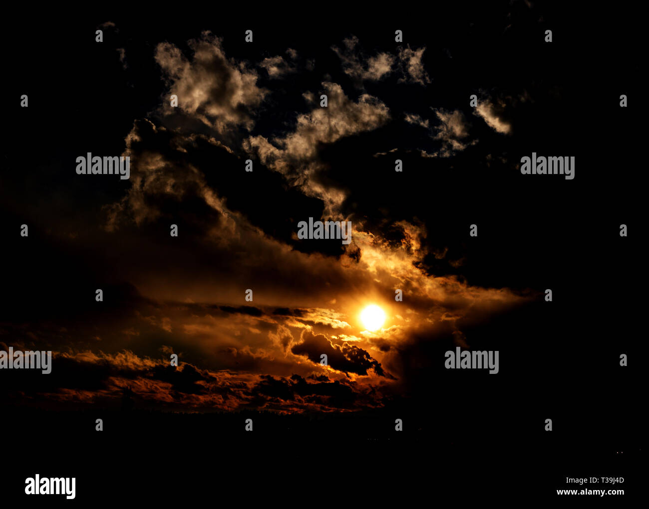 colorful apocalyptic sunset with mighty clouds Stock Photo - Alamy