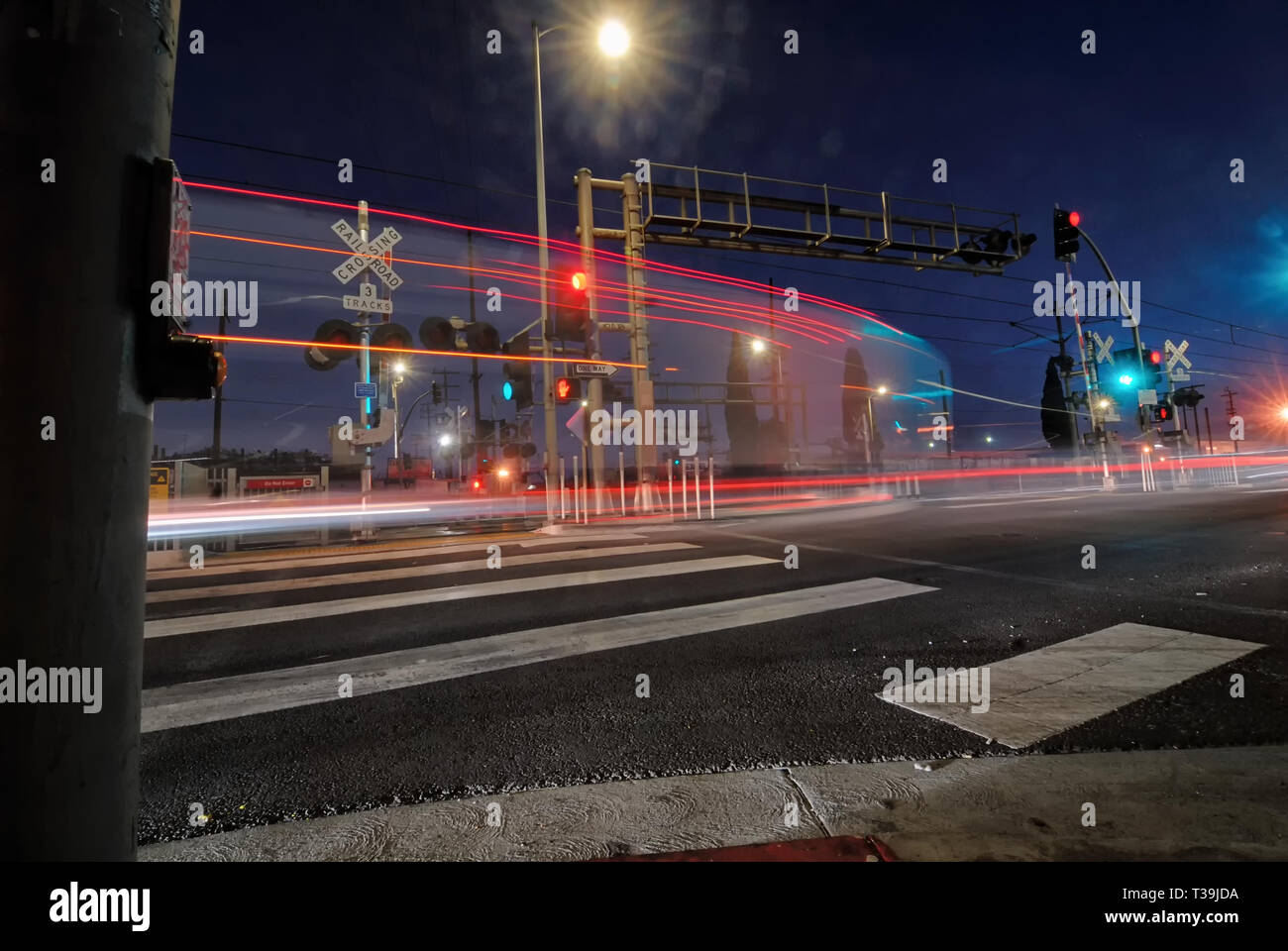 Streaks of light from the light rail train go dancing by in the night ...