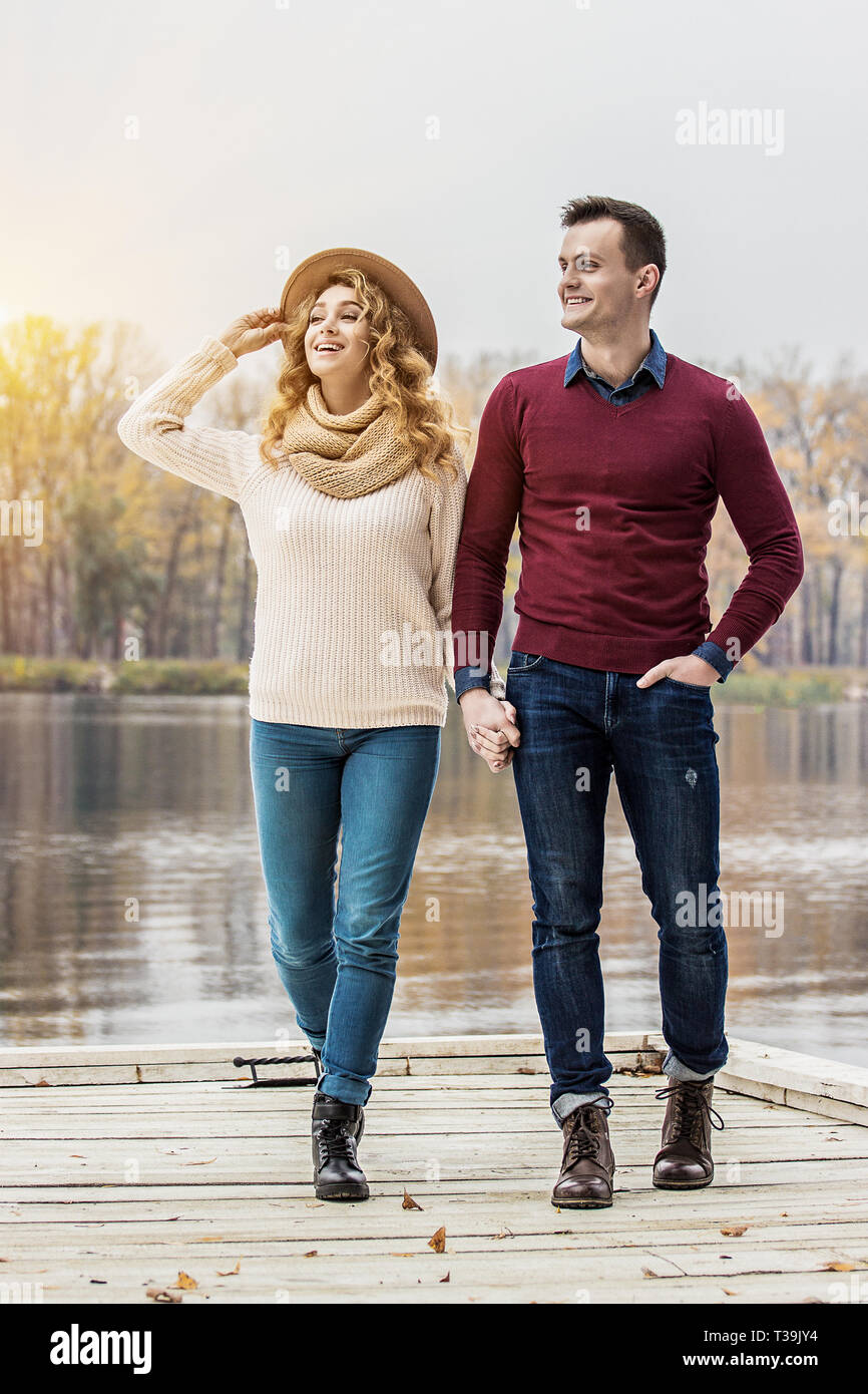 Enjoying carefree walk. Full-length of beautiful young couple walking ...