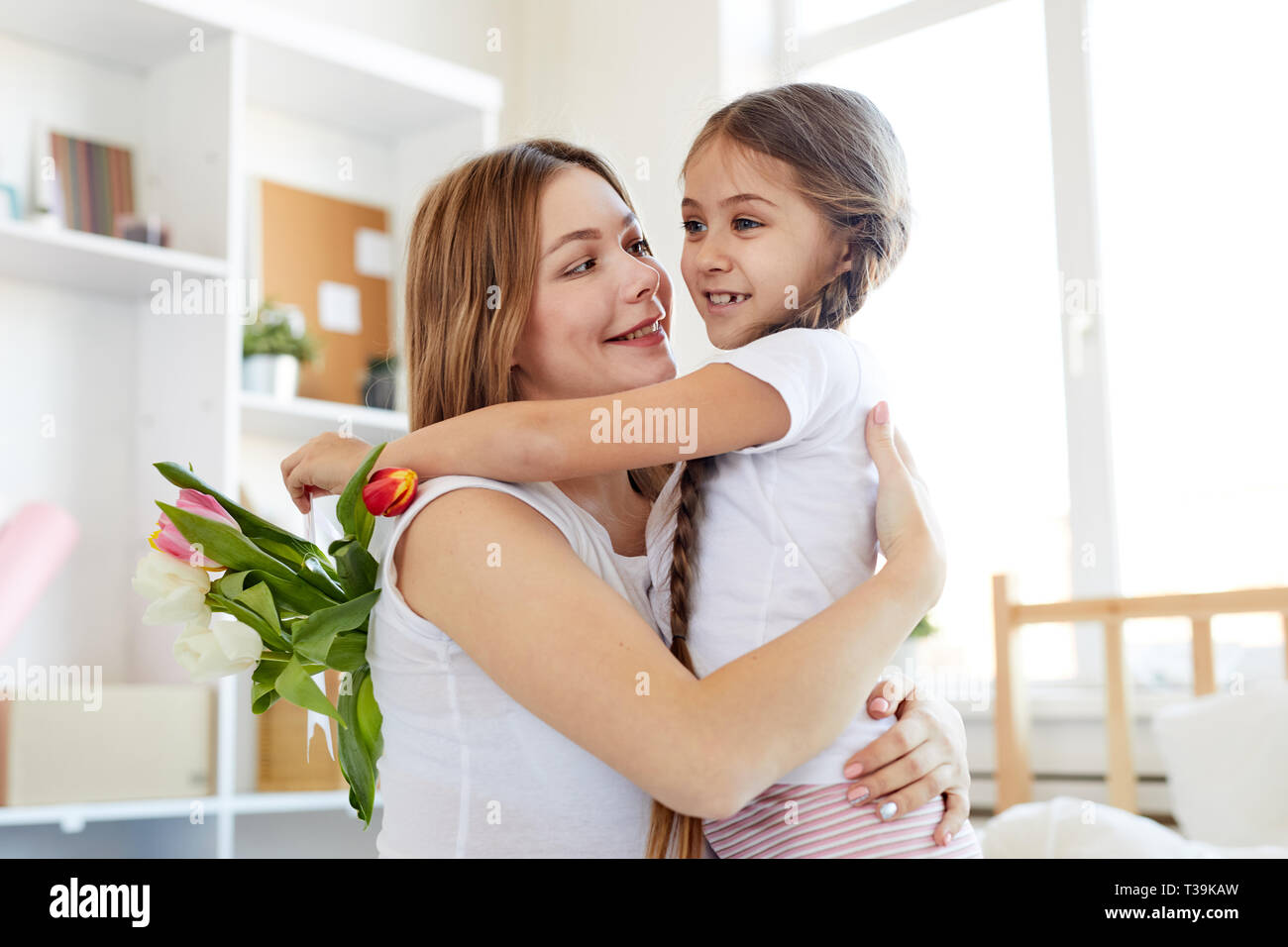 Mother and Daughter Embracing Stock Photo - Alamy
