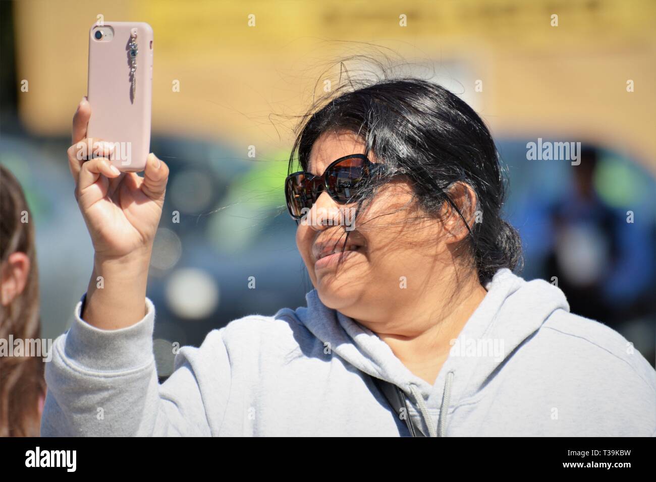 People who are real are using cell phones for making photo images at ...