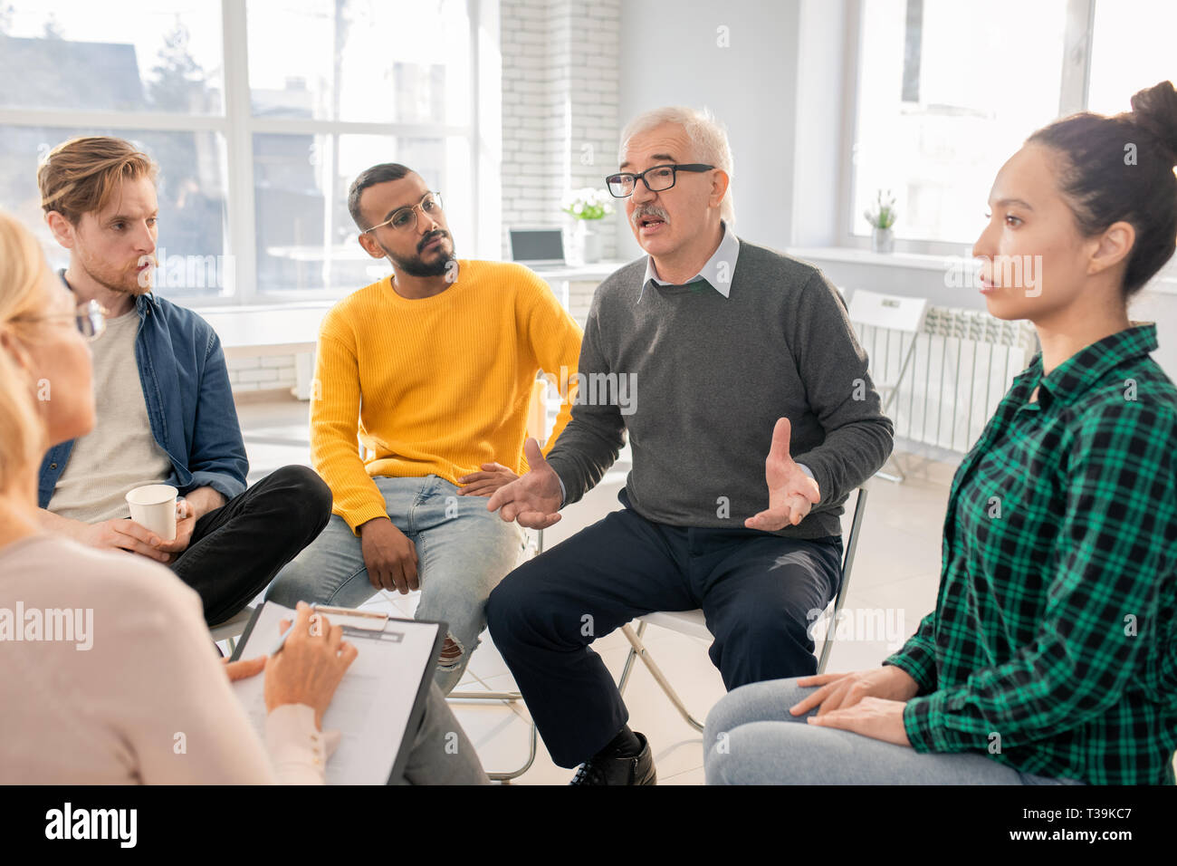 Senior man talking Stock Photo - Alamy