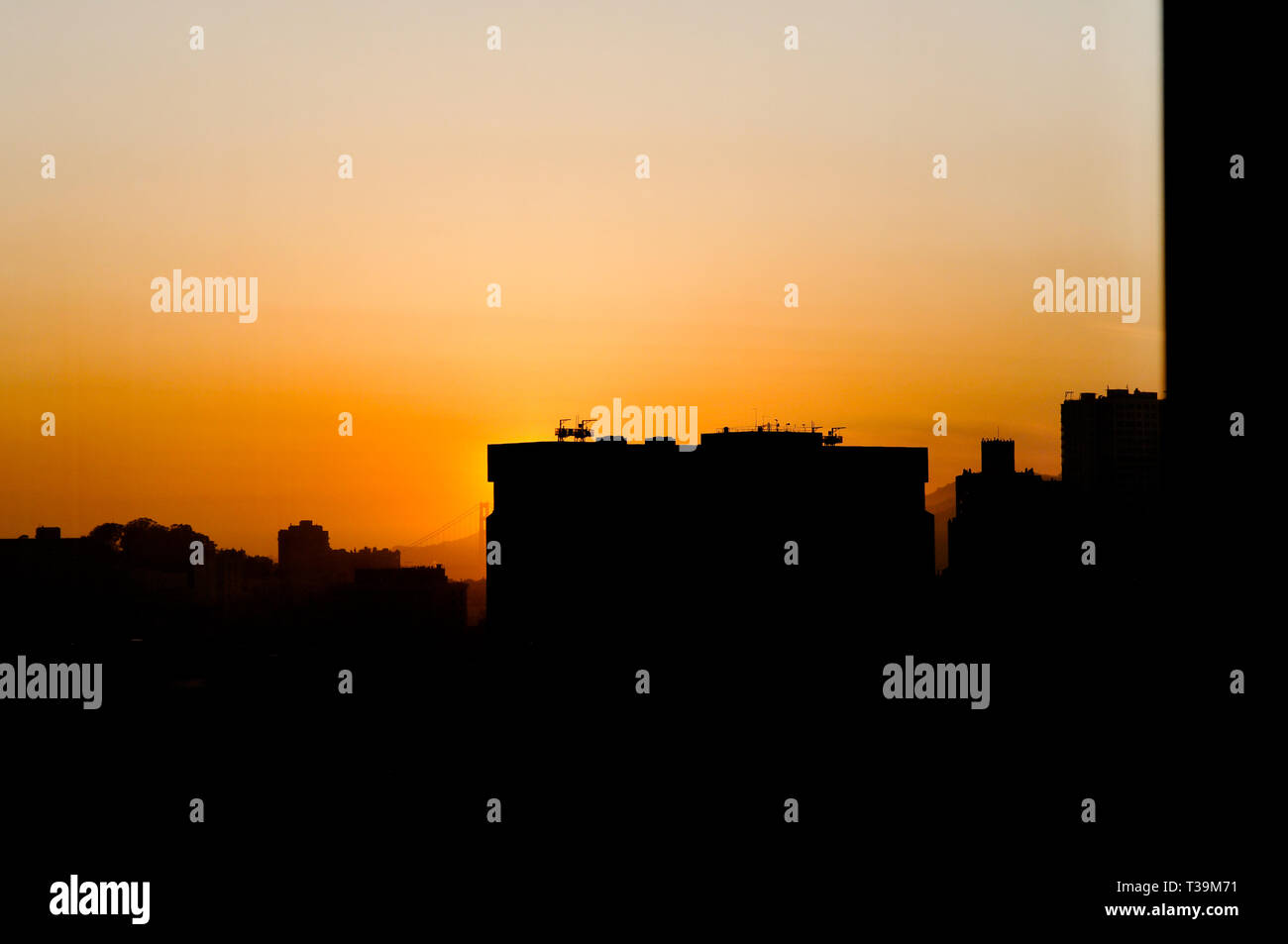 Urban city with tall buildings and sunset Stock Photo - Alamy