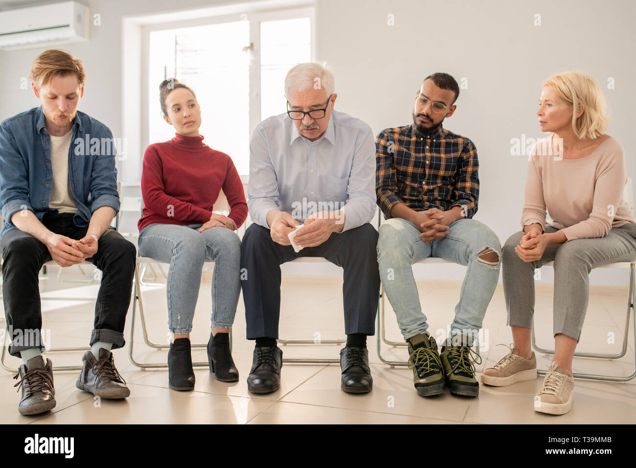 Listening to groupmate Stock Photo - Alamy