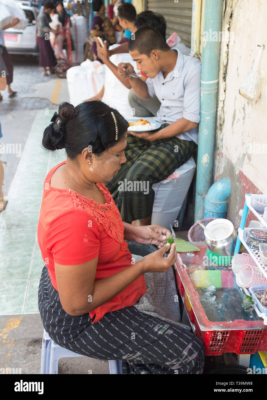 street vendor preparing Paan (betel chewing) , a preparation combining ...