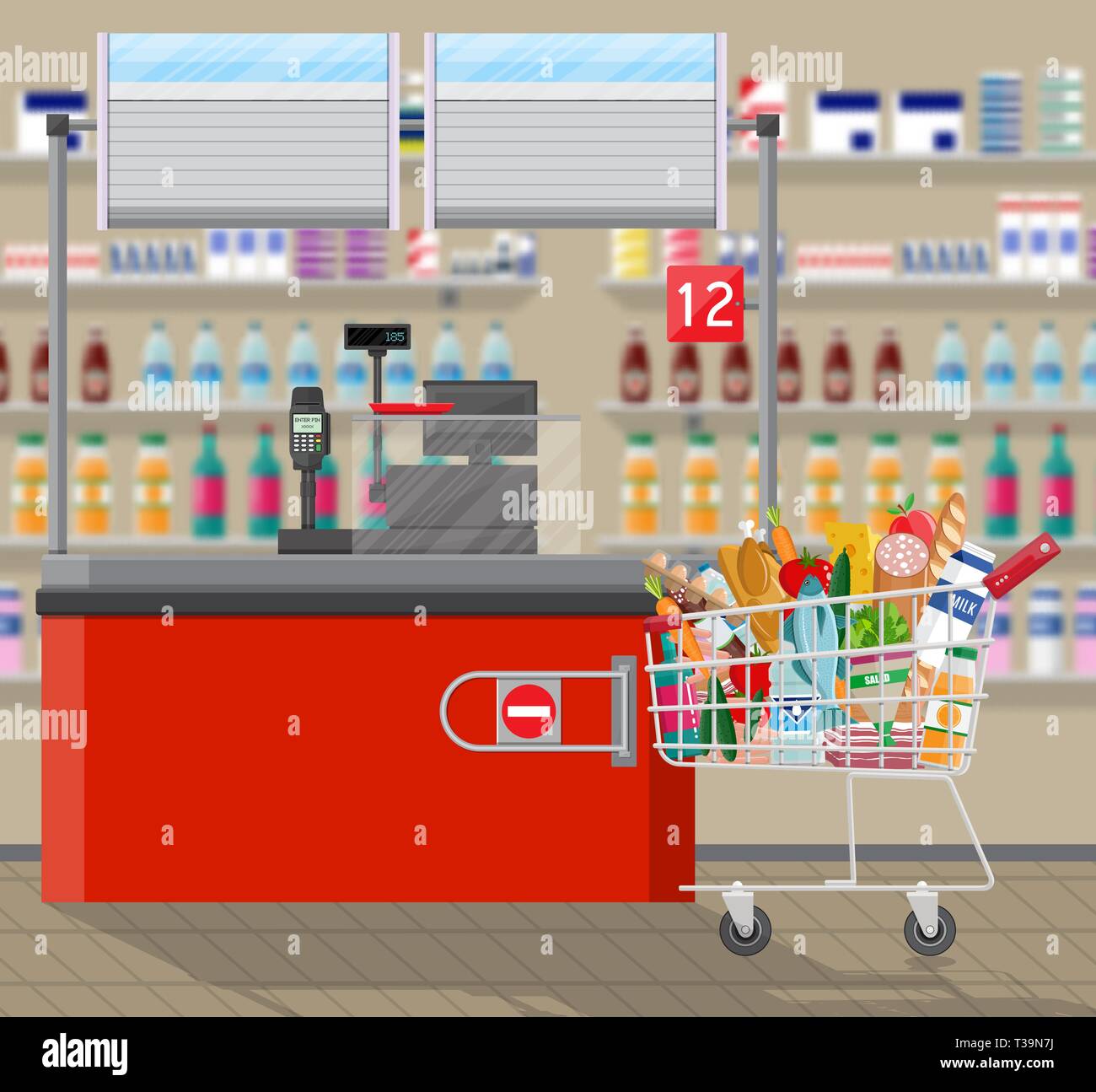 Supermarket interior. Cashier counter workplace. Shopping cart with ...