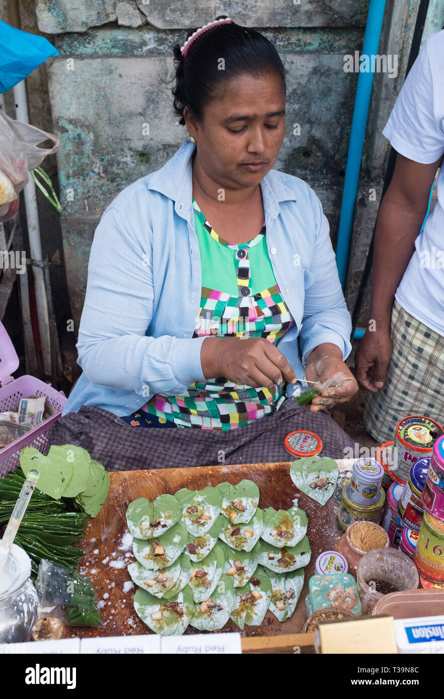 street vendor preparing Paan (betel chewing) , a preparation combining ...