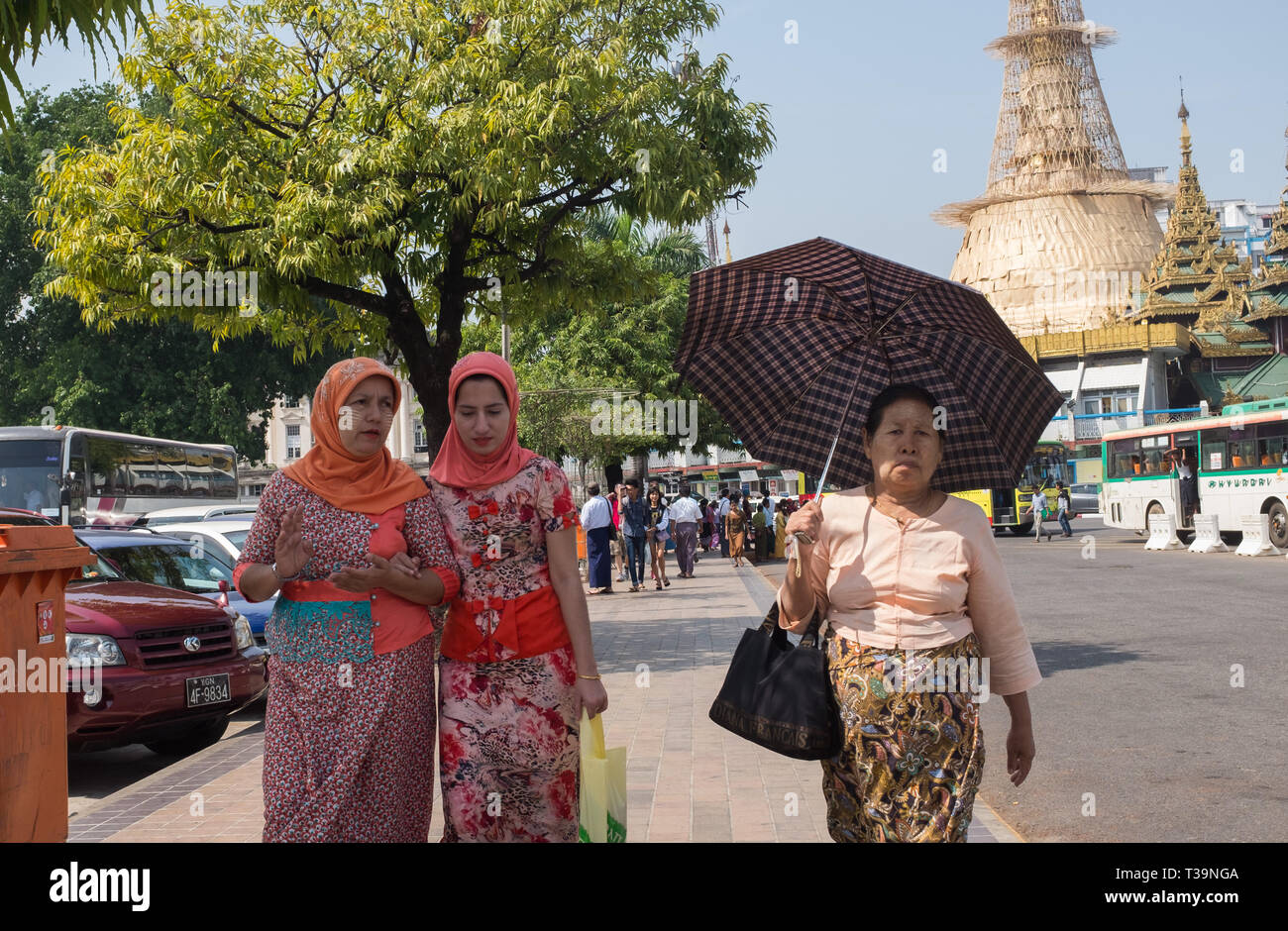 women wearing Thanaka paste,street scenery near Sule Pagoda in Yangon ...