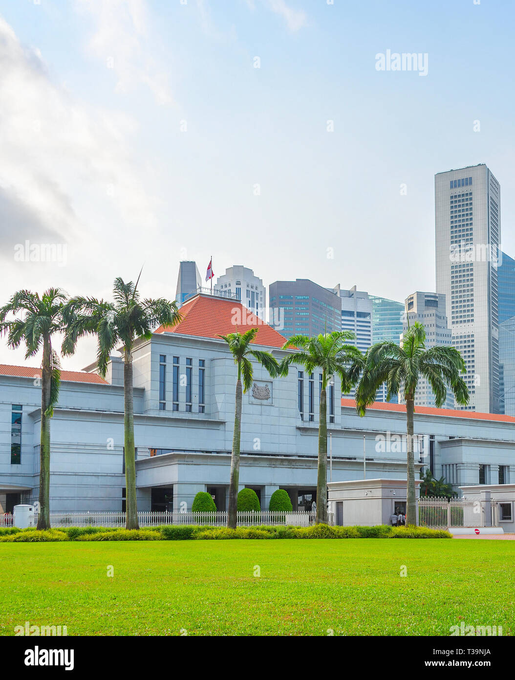 Singapore government building by green lawn, modern cityscape in ...