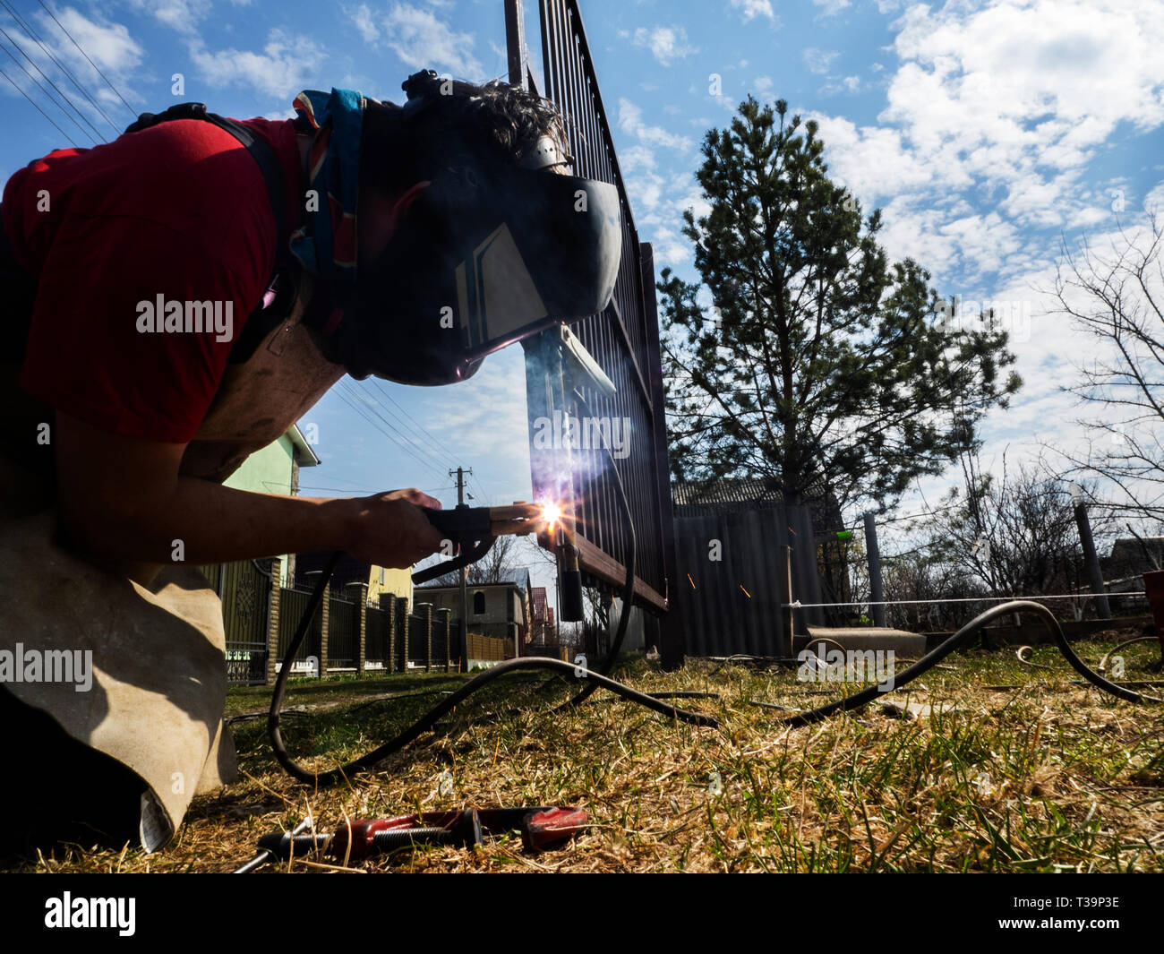 Man is welded to a steel gate metal latch Stock Photo - Alamy
