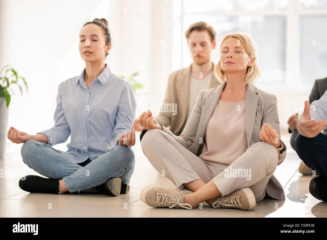 Professional meditating at work hi-res stock photography and images - Alamy