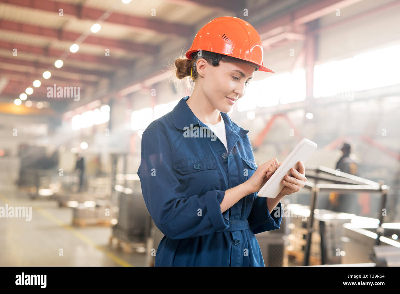 Woman industrial workplace hi-res stock photography and images - Alamy