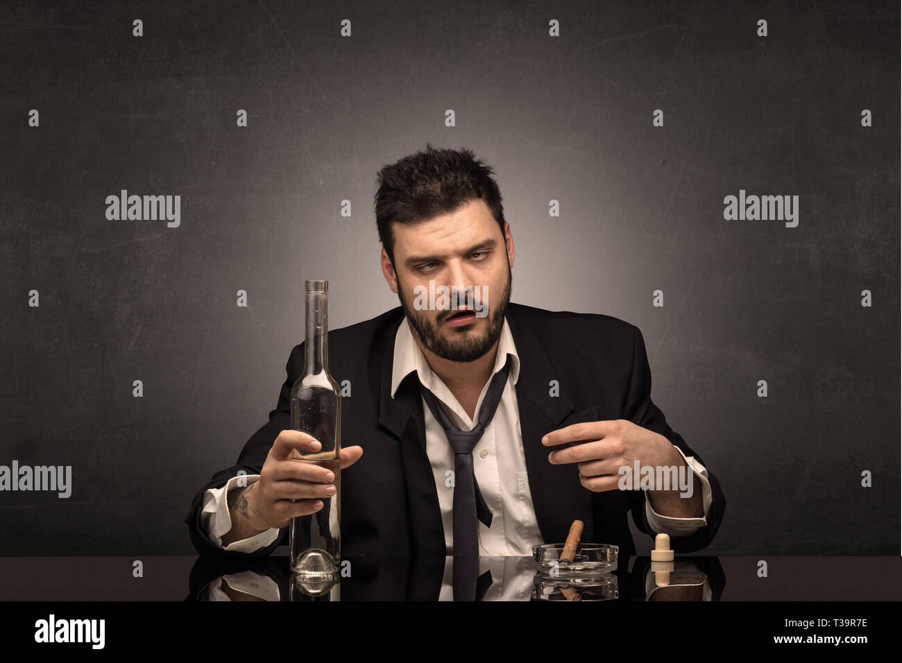 Young drunk man at his office with free dark copyspace Stock Photo - Alamy
