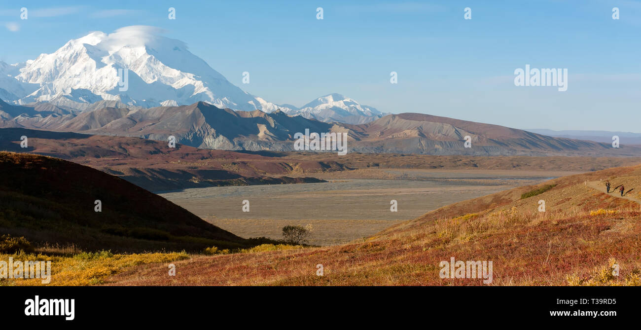 Two hikers give scale to the broad valley at the base of Mt Denali in ...