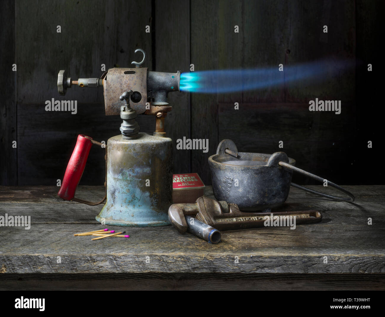 Old kerosene torch used by plumbers to melt lead for sealing pipes ...