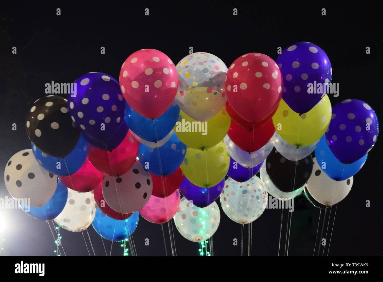 Festive balloons flying in sky hi-res stock photography and images - Alamy