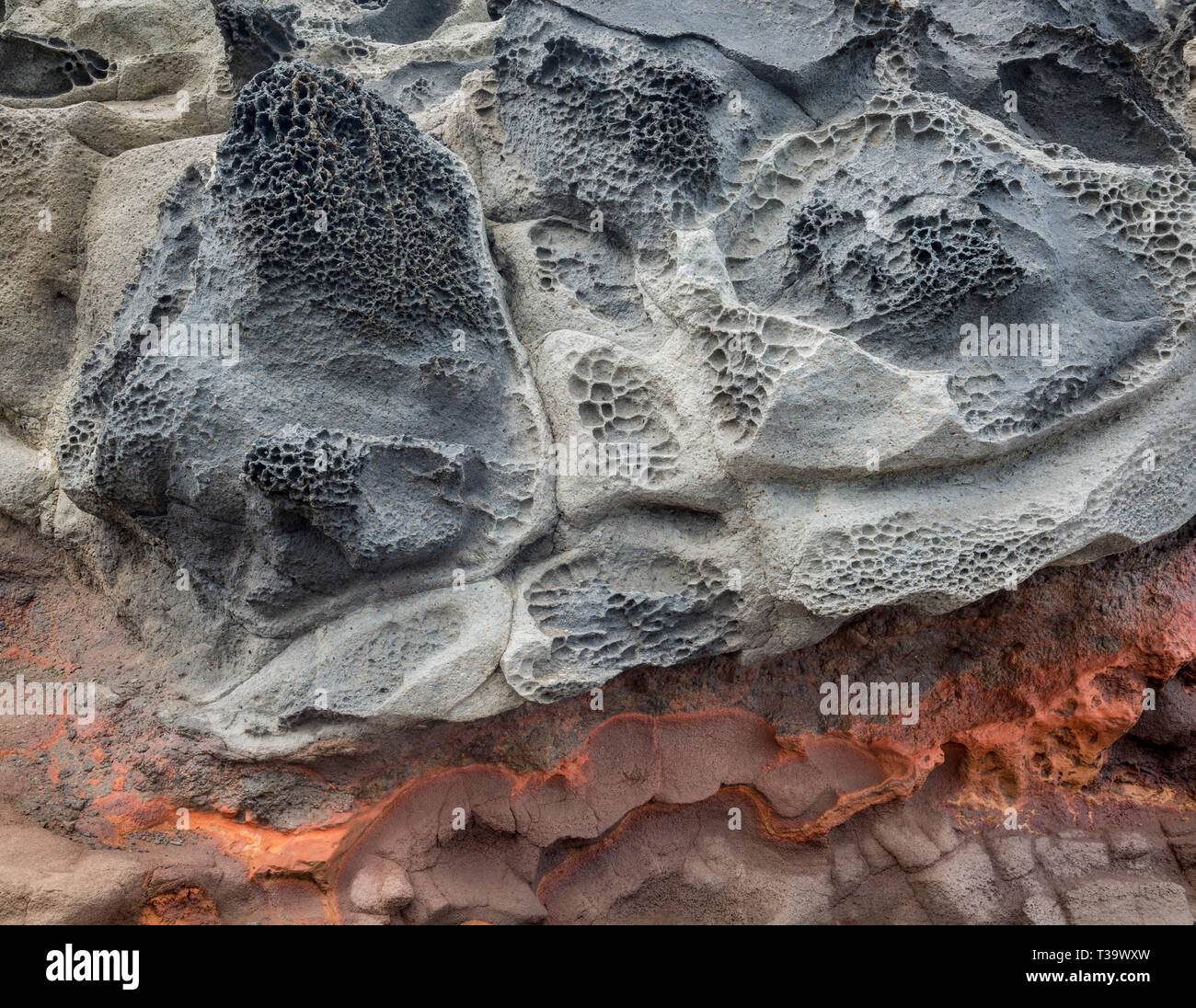 Lava rock exposed by road cut along the Kahekili Highway on the ...