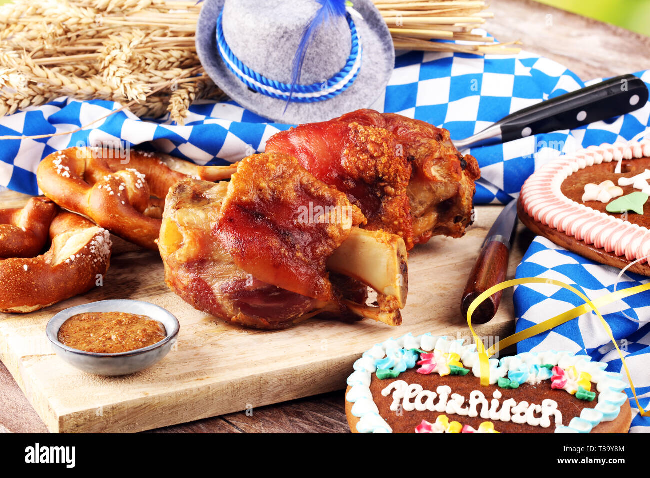 Traditional German cuisine, Schweinshaxe roasted ham hock. pretzels ...