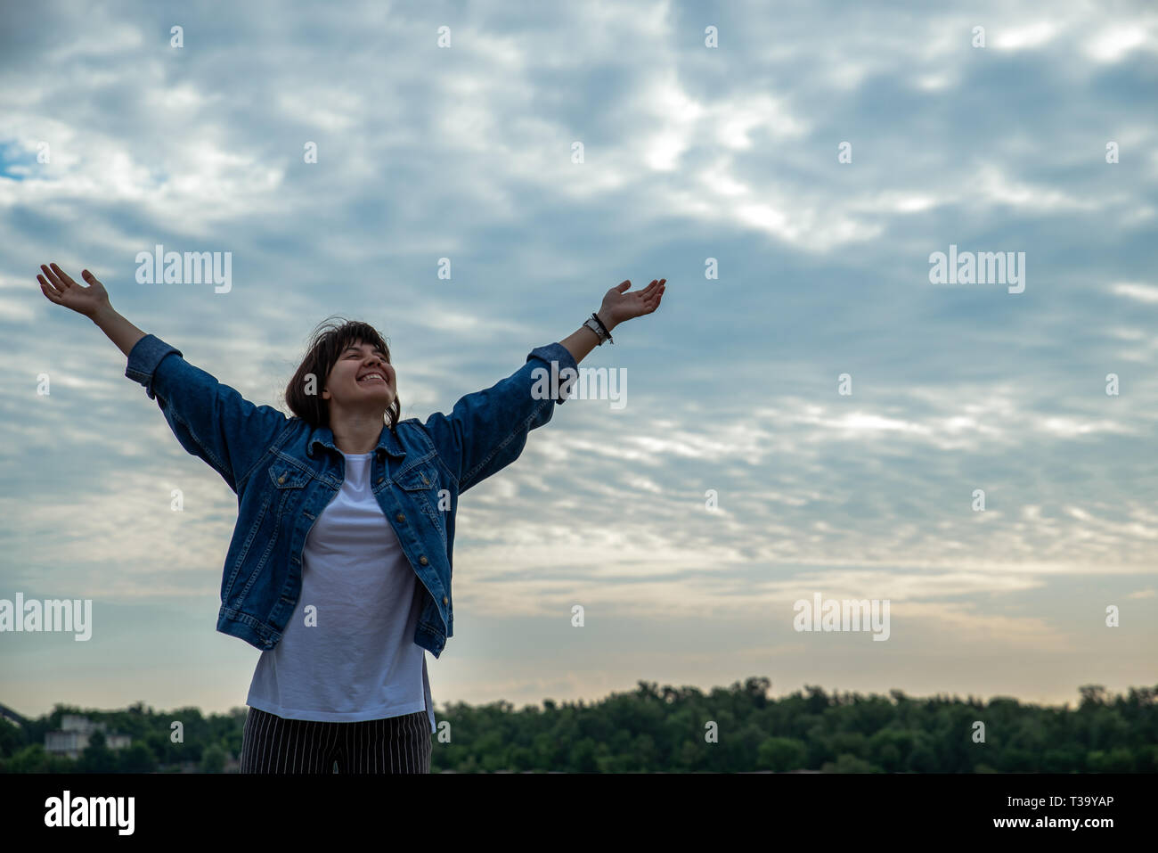young smiling pretty woman rise hands up. success concept Stock Photo ...