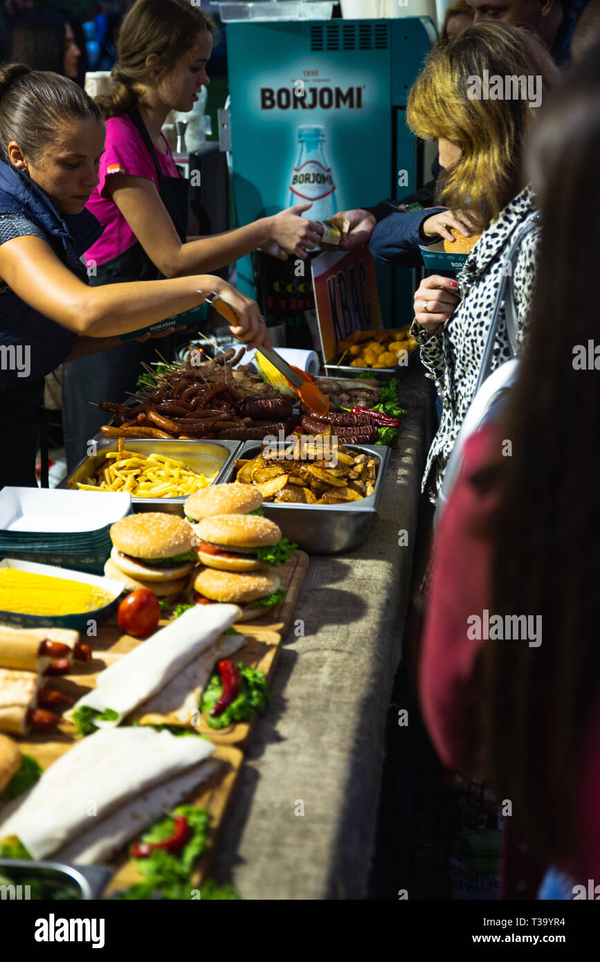 LVIV, UKRAINE - September 15, 2018: street food concept. people ...