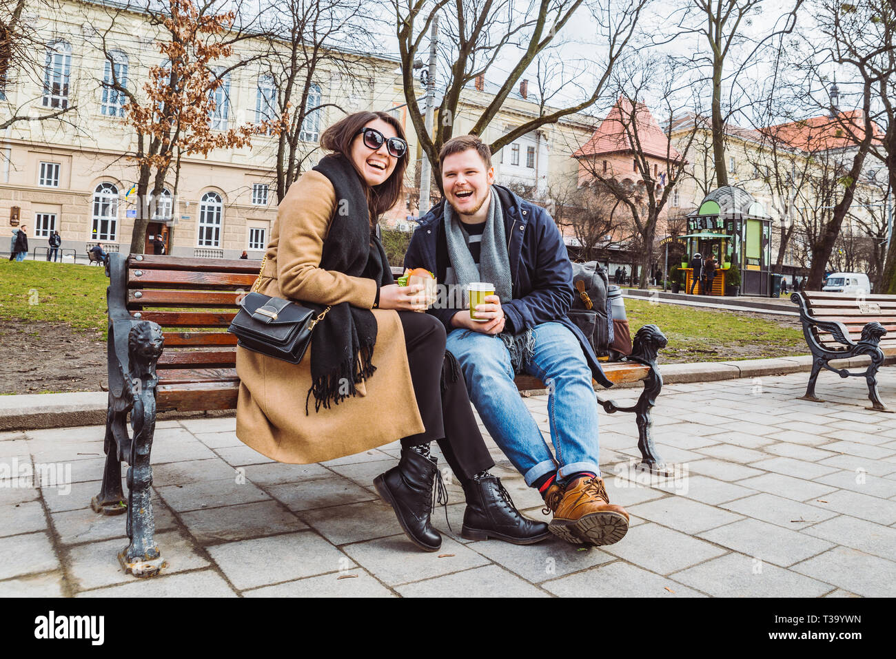 Woman eating burger bench hi-res stock photography and images - Alamy