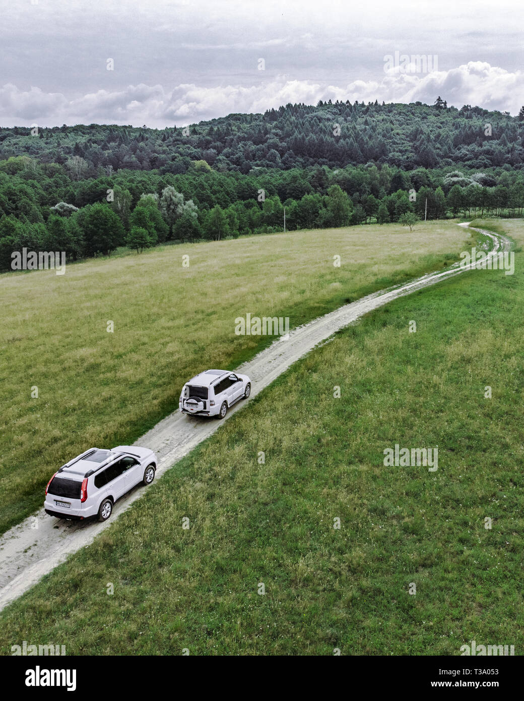 travel concept. two suv car riding by trail road. adventure time Stock ...