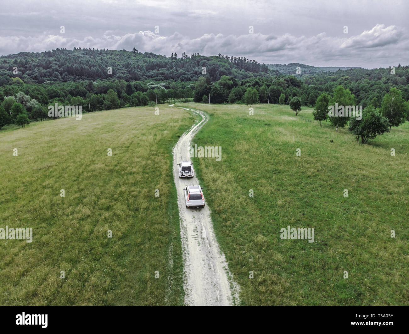 travel concept. two suv car riding by trail road. adventure time Stock ...