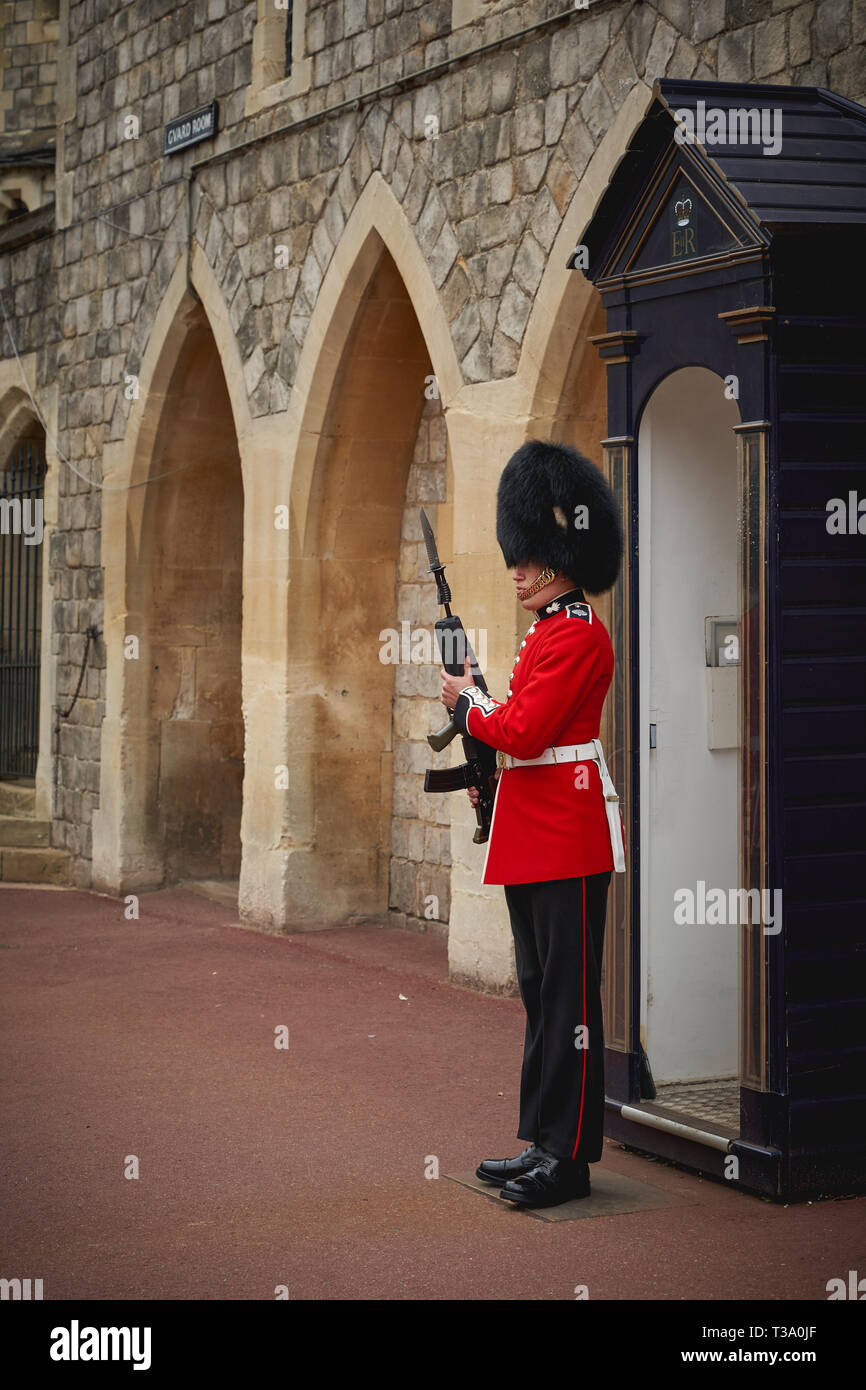 Windsor, UK - December, 2018. A sentry grenadier guard in his iconic ...