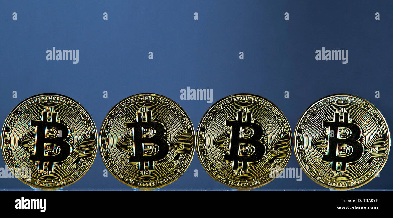 Bitcoin "coins" are photographed to represent cryptocurrency Bitcoin in ...