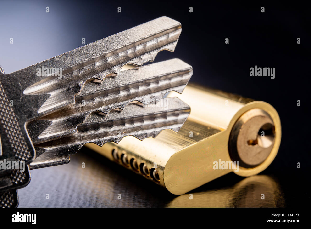 A new door lock on a dark background. A patent and keys to secure the ...