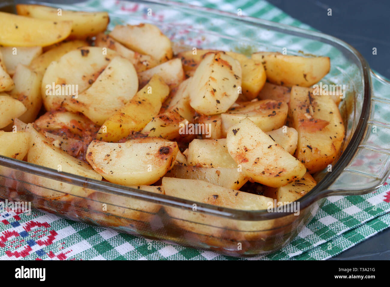 Baked Potatoes in glass form against dark background Stock Photo - Alamy