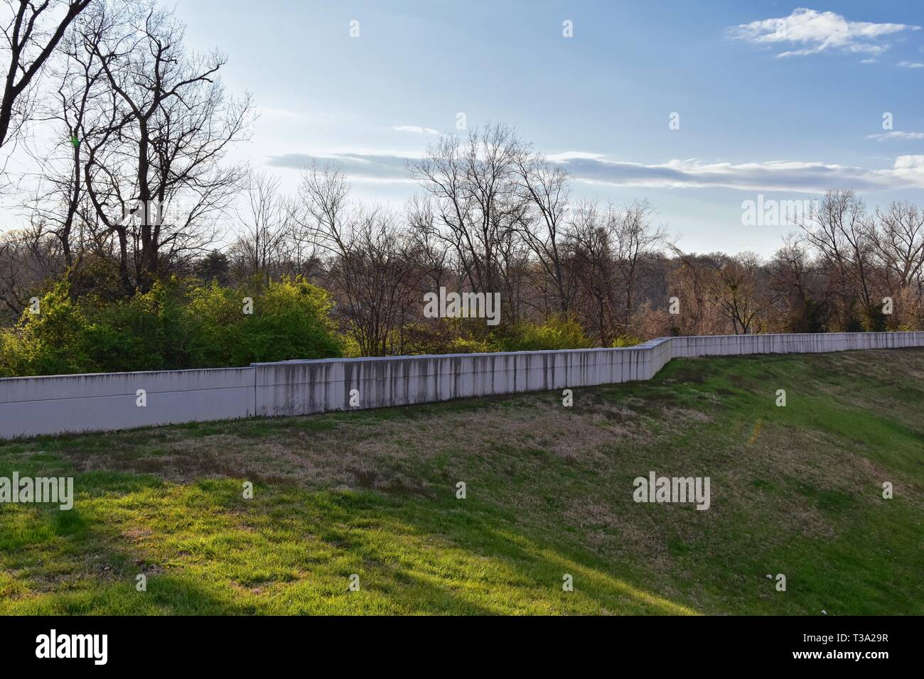 Spillway and flood barrier views of metal dike to protect from flooding ...