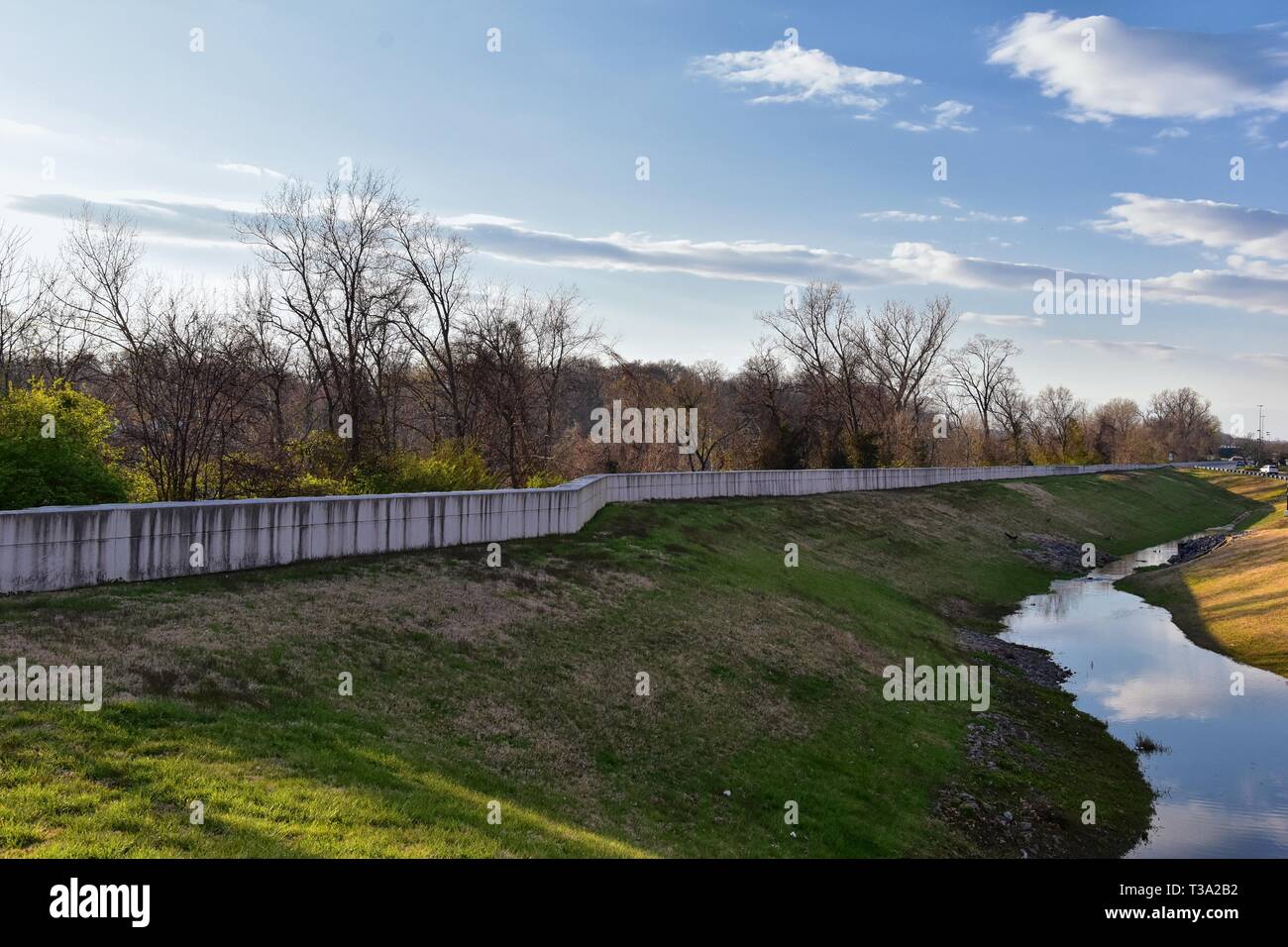 Spillway and flood barrier views of metal dike to protect from flooding ...
