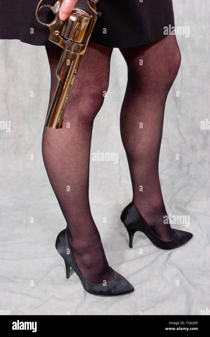 Woman holding revolver hi-res stock photography and images - Alamy