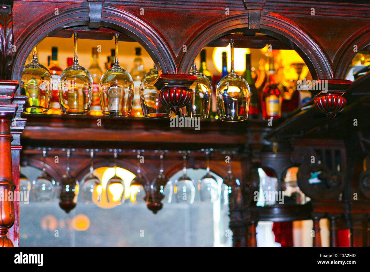 Antique Mahogany back bar with wine glasses and liqueur bottles Stock ...