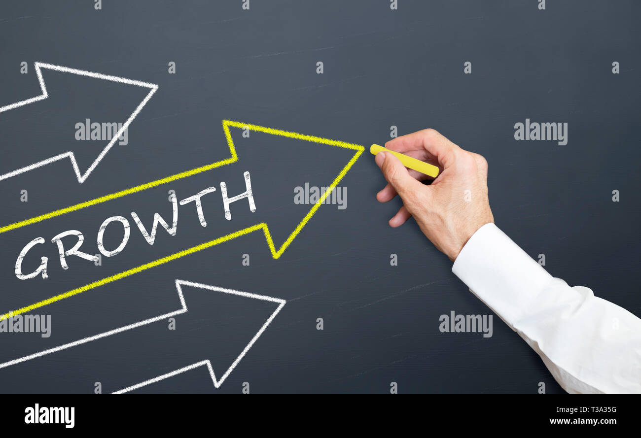man drawing arrow. growth concept Stock Photo - Alamy