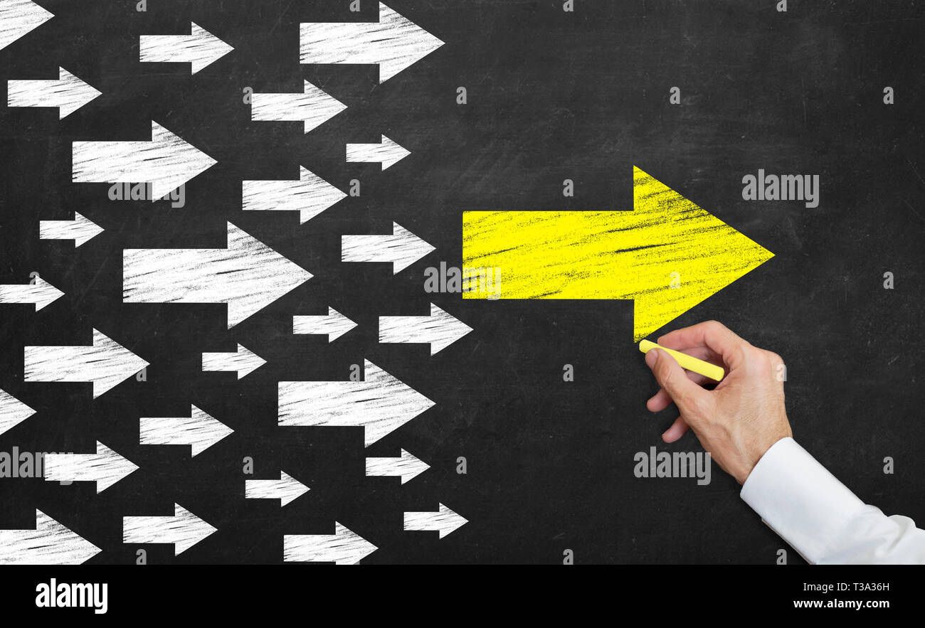 yellow arrow leading to white arrows Stock Photo - Alamy