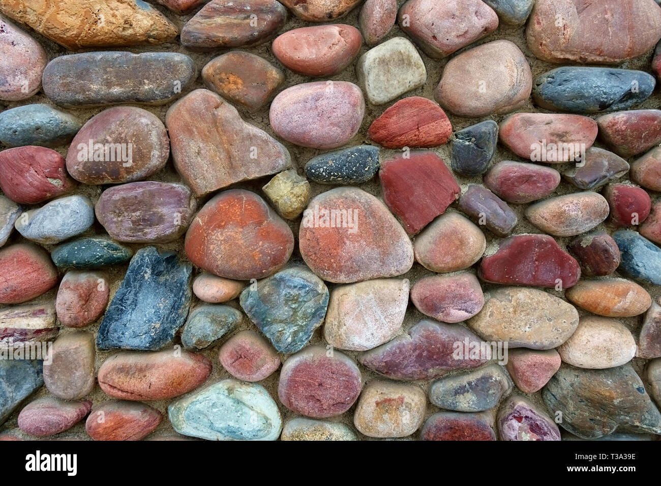 Section of a colorful rock wall Stock Photo - Alamy