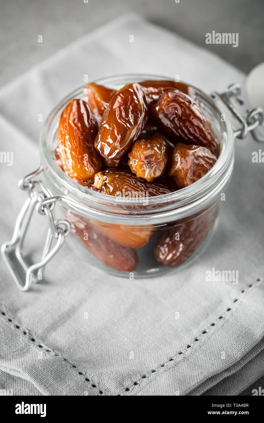 Blessed or kameen ramadan with dates fruit in a glass jar. Typical ...