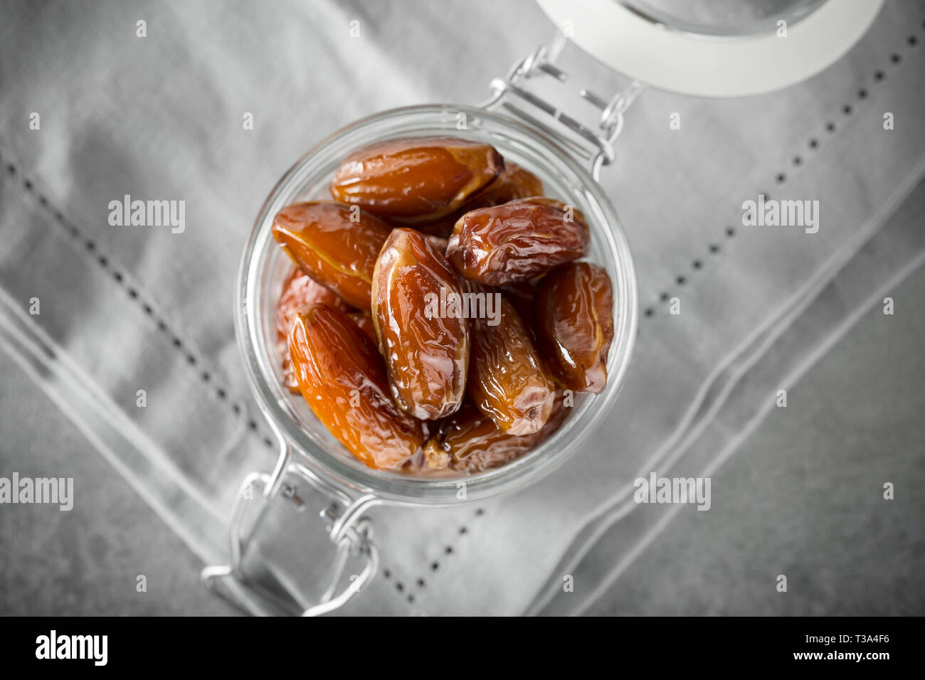 Blessed or kameen ramadan with dates fruit in a glass jar. Typical ...