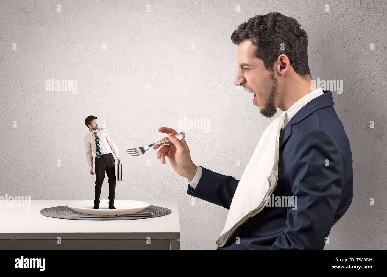 Tiny scared weak businessman almost devoured by great power Stock Photo ...