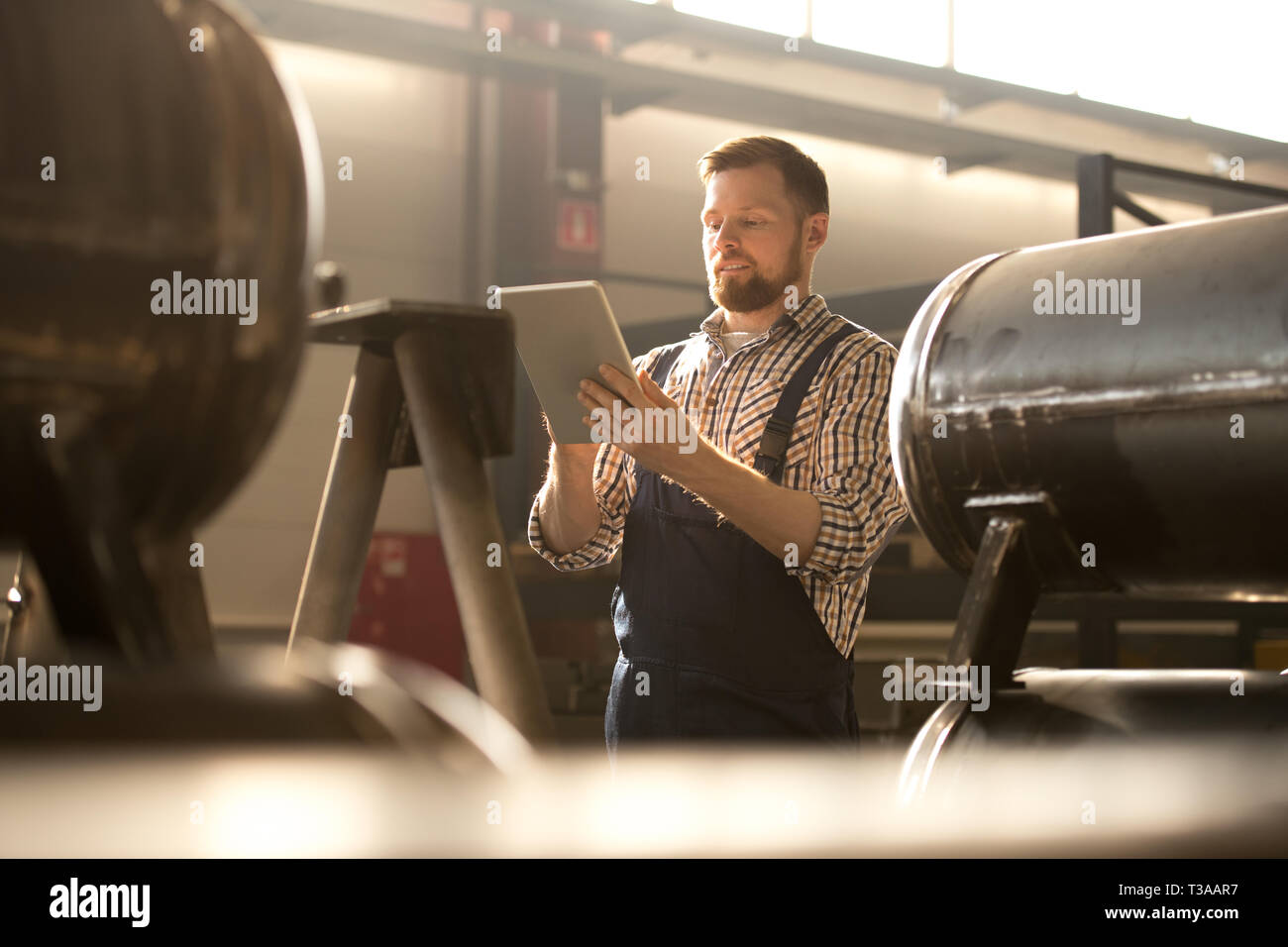 Working in industrial plant Stock Photo - Alamy