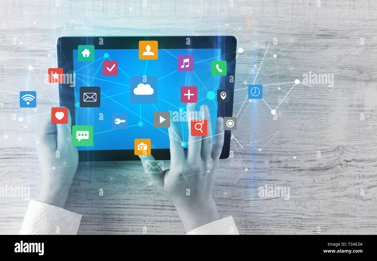 Hand touching multitask tablet with cloud wifi message social media ...