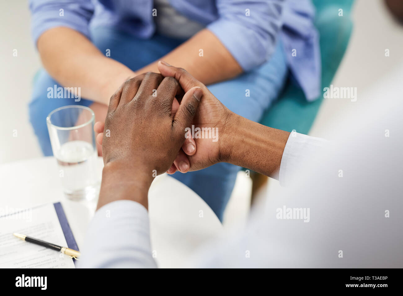 African holding hands support hi-res stock photography and images - Alamy