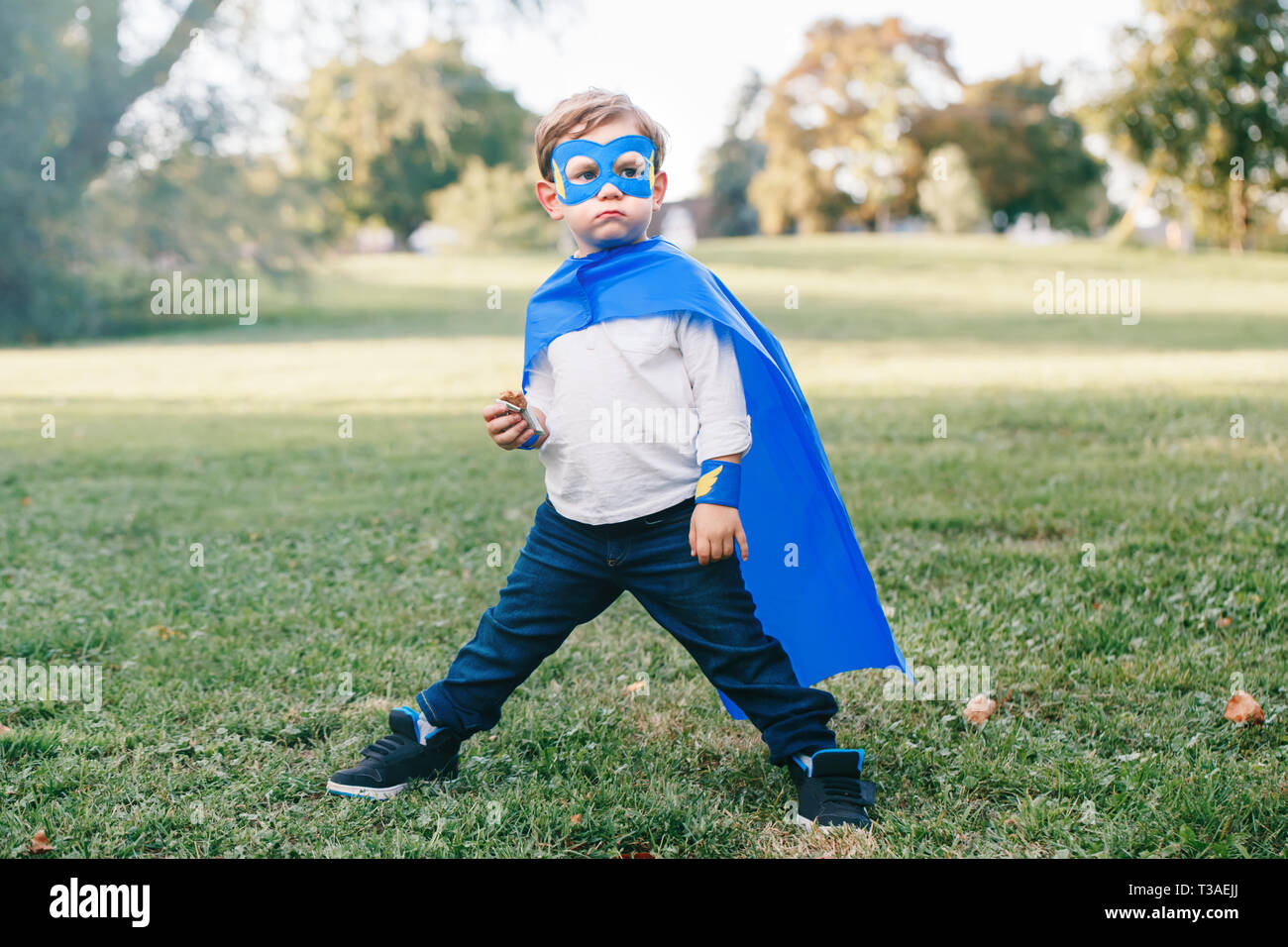 Cute adorable preschool Caucasian child playing superhero in blue ...