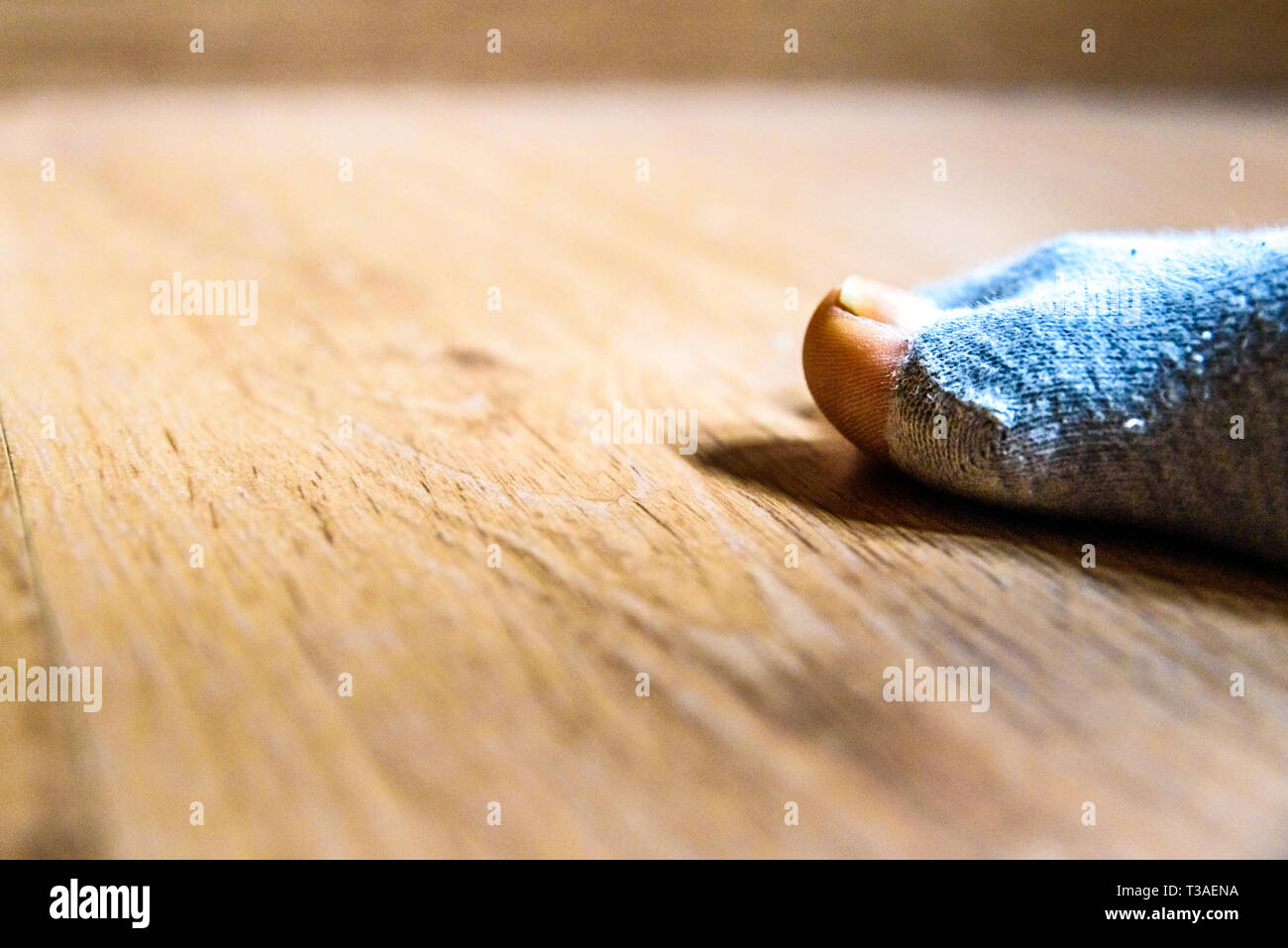 Broken sock with a hole in a man's big toe, concept of poverty during ...