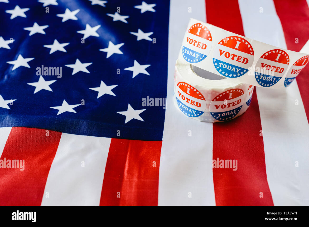 I vote today stickers roll, in US elections on American flag Stock ...