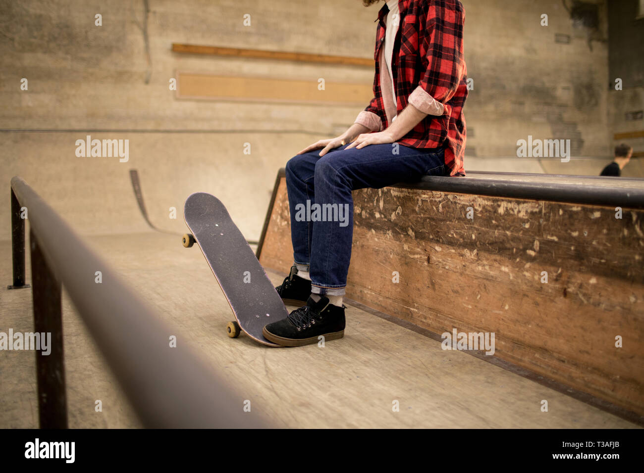Man Sitting on Ramp Stock Photo - Alamy