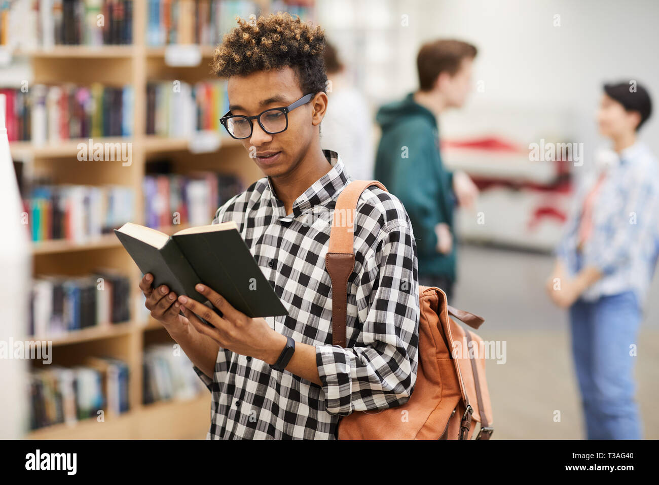 Intelligent Guy Reading Book In Library Stock Photo Alamy intelligent-guy-reading-book-in-library-stock-photo-alamy